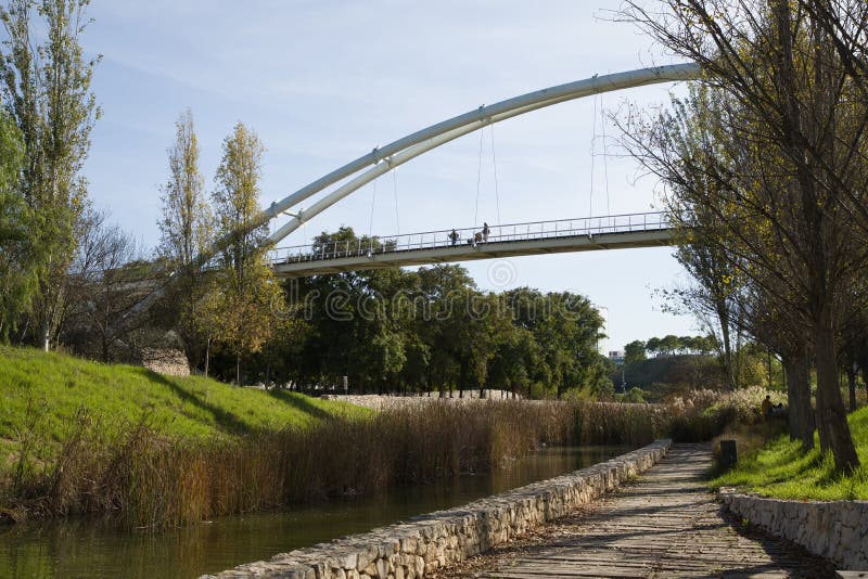 Pedestrian Bridge Over a River in a Park Stock Image - Image of travel ...