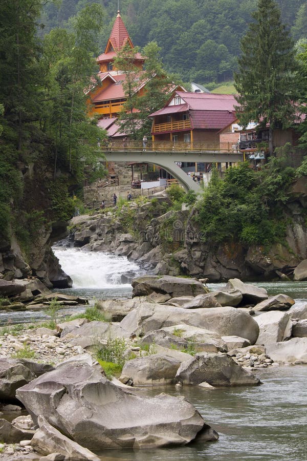 Pedestrian Bridge Over a Waterfall on a Mountain River Stock Image ...