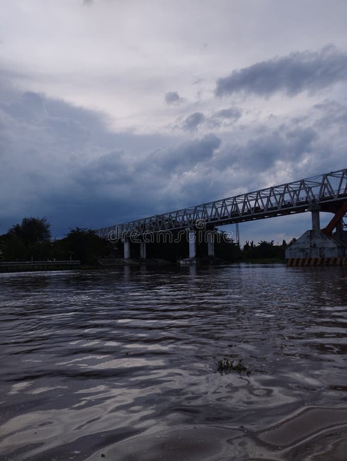 A Pedestrian Bridge in a Riverside Village Stock Photo - Image of dawn ...