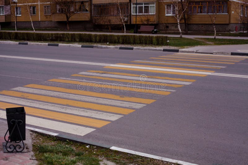 Pedestrian Crosswalk on Asphalt in White and Yellow Paint Stock Photo ...
