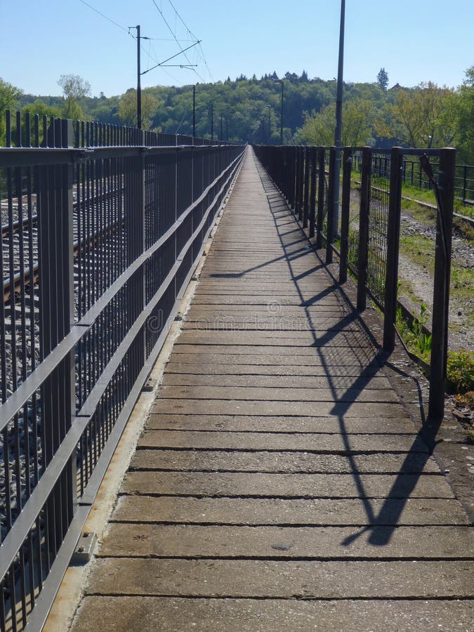 Concrete Pedestrian Bridge With Metal Railing In Perspective. Stock ...