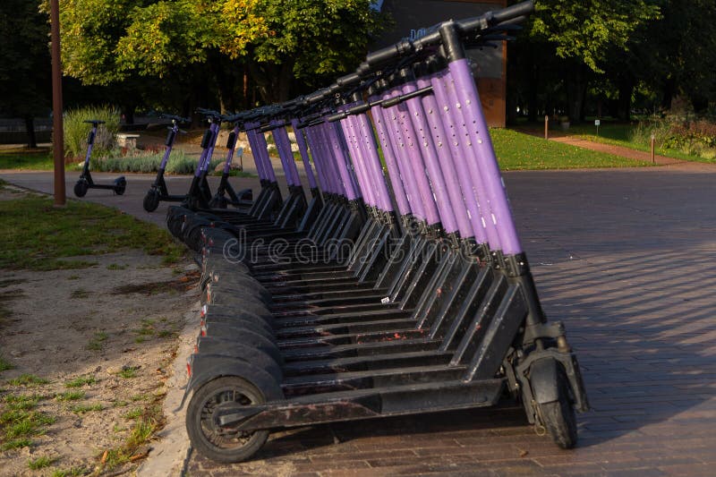 Pedestrian Path and Scooters for Rental Standing in a Row. Stock Image ...