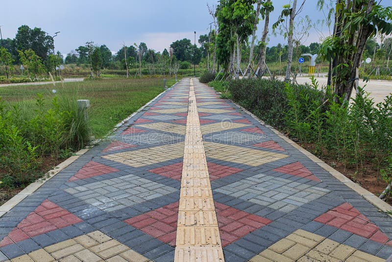 Pedestrian Pathway with a Colorful Paving Block Pattern and Guiding ...