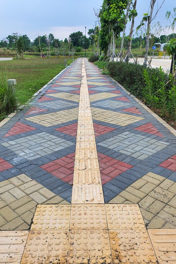Pedestrian Pathway with a Colorful Paving Block Pattern and Guiding ...