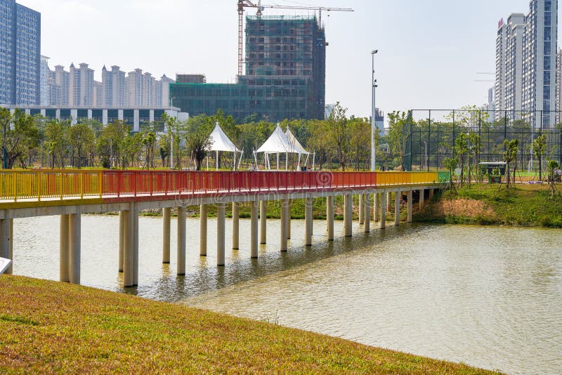 A Pedestrian Rainbow Bridge Over the City River Stock Image - Image of ...
