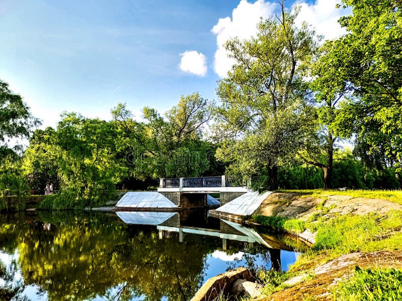 Pedestrian Stone Bridge Over the Pond in Park Stock Photo - Image of ...