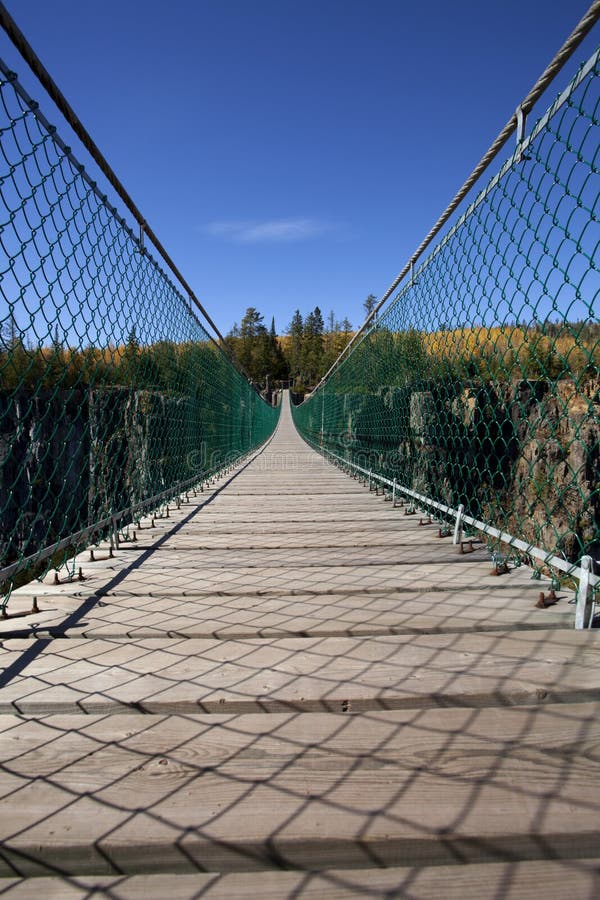 Narrow Rope Pedestrian Bridge Stock Photo - Image of river, suspension ...
