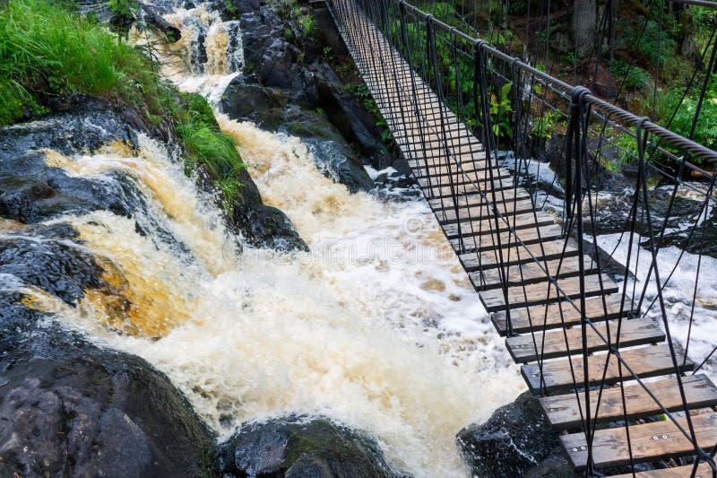 Pedestrian Suspension Bridge Over the Fast Raging Stock Photo - Image ...