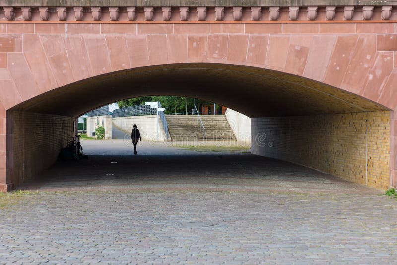 Pedestrian Under the Bridge. Stock Photo - Image of people, street ...