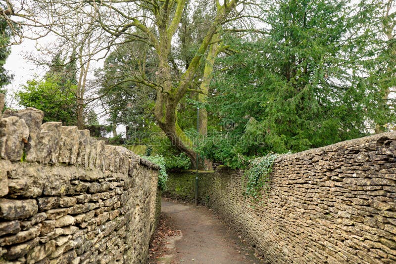 Pedestrian Walkway with Old Stone Wall in UK Stock Photo - Image of ...