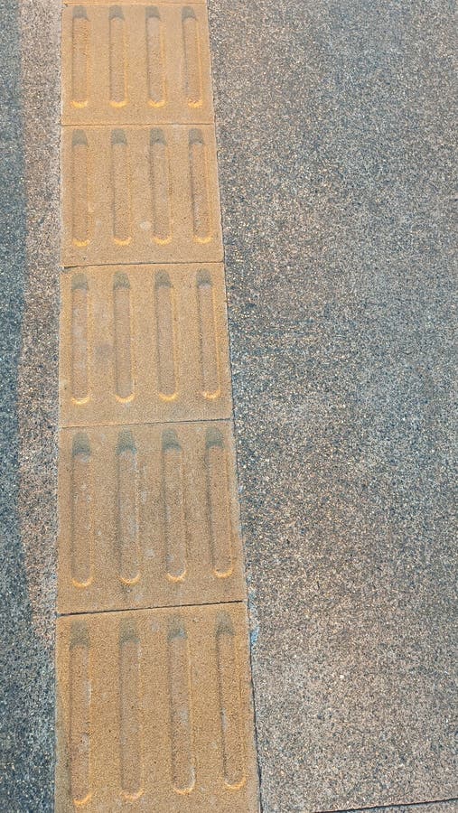 Pedestrian Walkway in Residential Complex with Yellow Accessibility ...