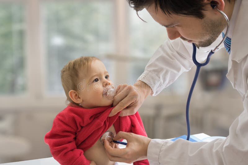 Pediatrician Doctor is Examining Child with Stethoscope Stock Photo ...