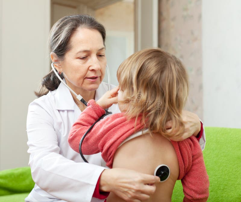 Pediatrician Examining Child with Stethoscope Stock Photo - Image of ...