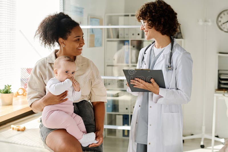 Pediatrician Talking To Mom during Her Visit Stock Image - Image of ...