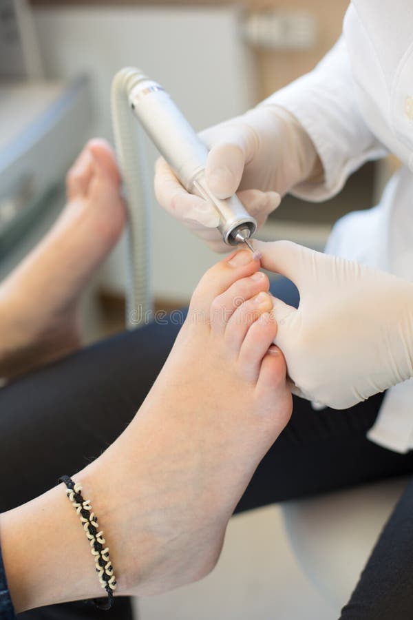 Pedicurist Grinding Toenails Stock Image - Image of beauty, people ...