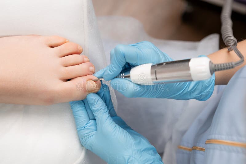 Pedicure Master in Rubber Gloves Making Hardware Pedicure Using Nail ...