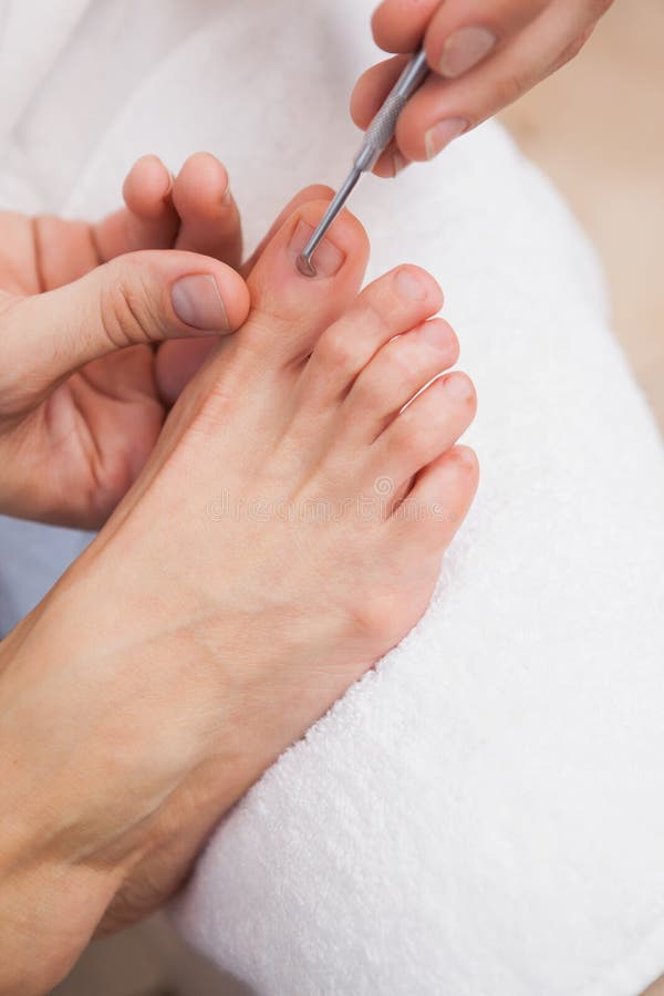 Pedicurist Cleaning a Customers Toe Nails Stock Image - Image of focus ...