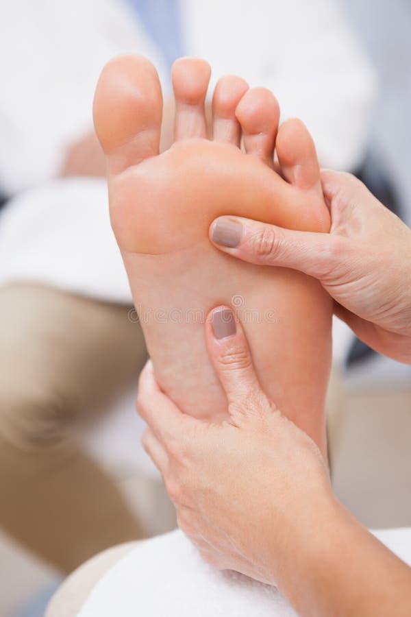 Pedicurist Massaging Customers Foot Stock Image - Image of indoors ...