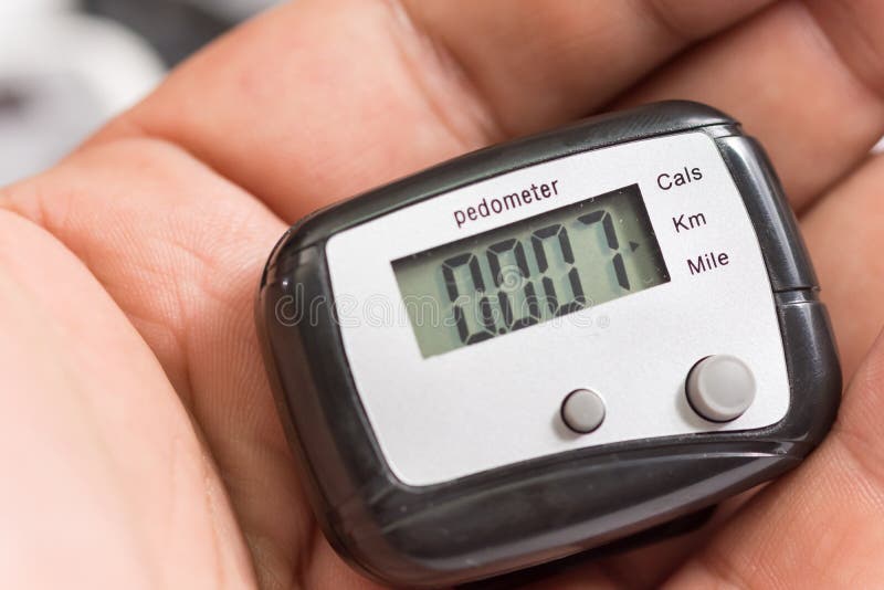 Pedometer in the hand stock photo. Image of showing, health - 65096142