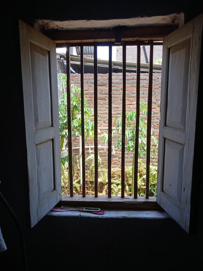 Peek Outside with Wooden Barred Windows Stock Photo - Image of ...