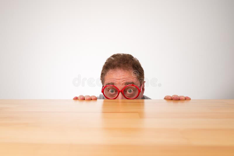 Peeking over the table stock image. Image of professional - 49012901