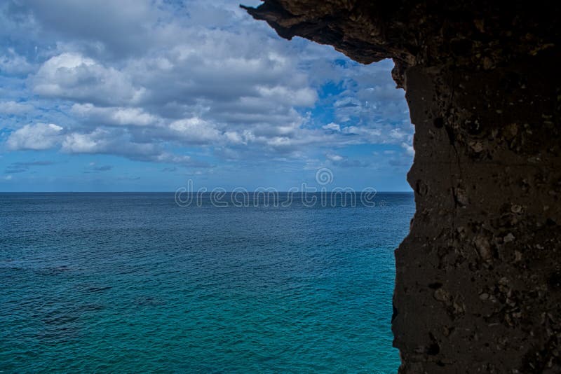 Peeking at the Sea stock photo. Image of rock, seascape - 135152680