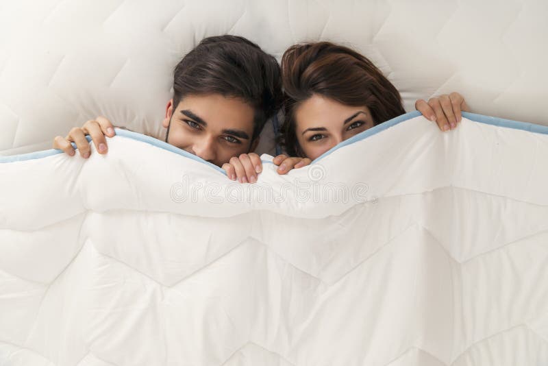 Peeking under the sheets stock photo. Image of dating - 112567118