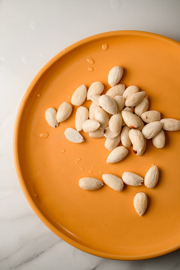 Peeled Almonds Arranged Neatly on a Simple Plate Stock Photo - Image of ...