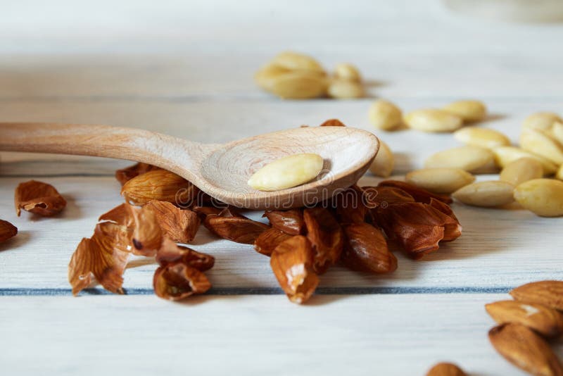Peeled Almonds on the Table. Stock Photo - Image of spoon, brown: 124725886