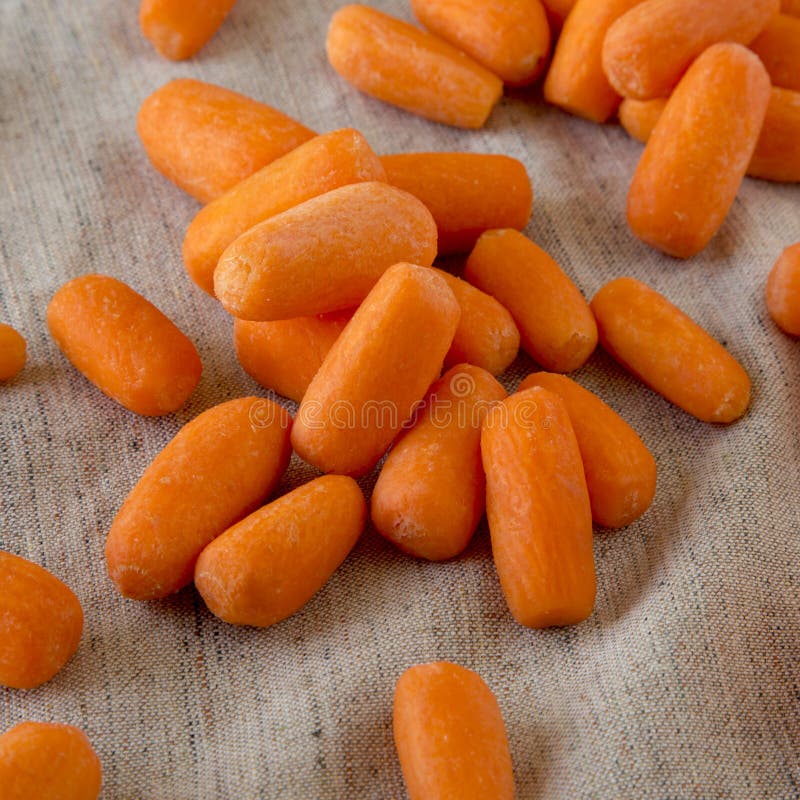 Peeled Baby Carrots on Cloth, Side View. Close-up Stock Photo - Image ...
