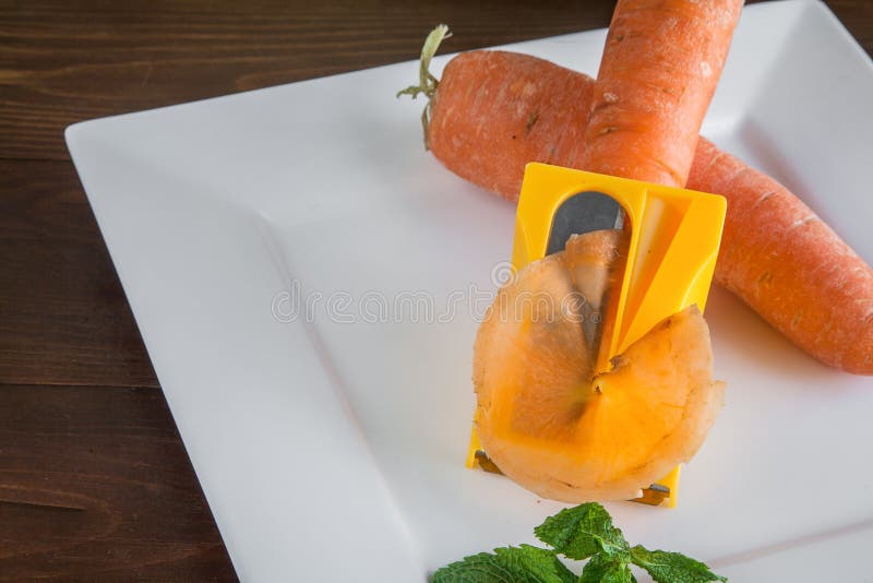Peeled Carrots with Sharpener Stock Photo - Image of vegetable, closeup ...