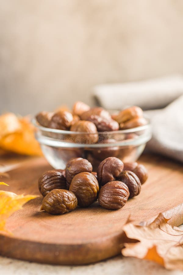 Peeled Chestnuts. Sweet Roasted Chestnuts on Cutting Board Stock Photo ...