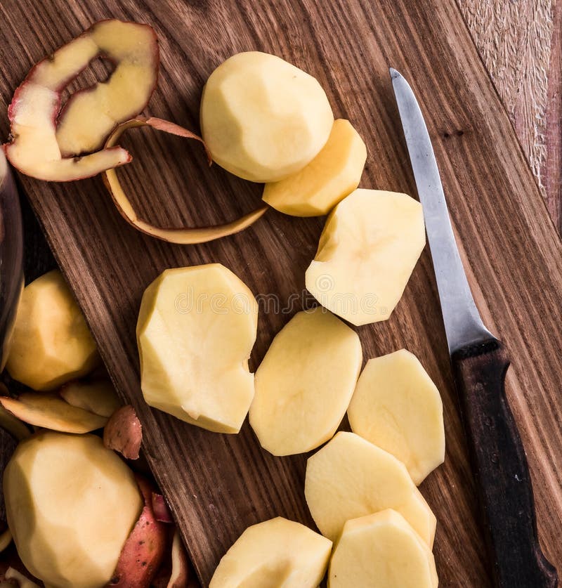 Peeled and cut potato stock image. Image of crop, board - 66126617