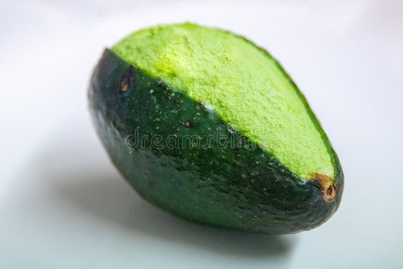 Peeled fresh avocado stock photo. Image of skin, riped - 324524042