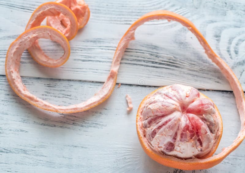 Peeled grapefruit close up stock photo. Image of round - 103553192