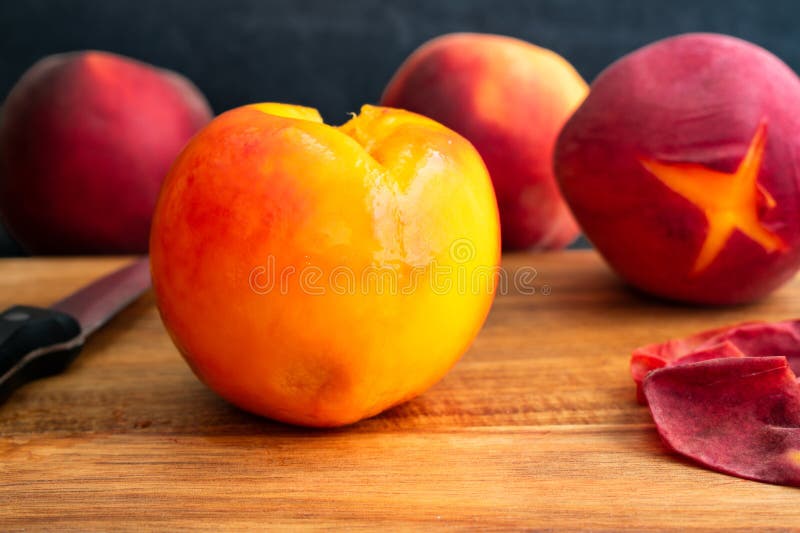 Peeled Peach on a Wood Cutting Board Stock Image - Image of peeling ...