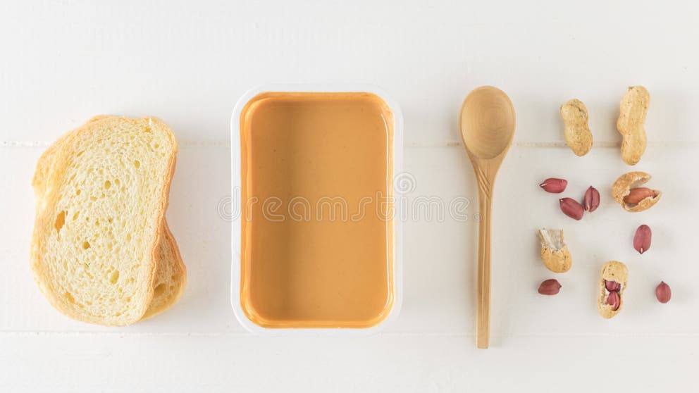 Peeled Peanuts, Bread and Peanut Paste on a White Wooden Table. Stock ...