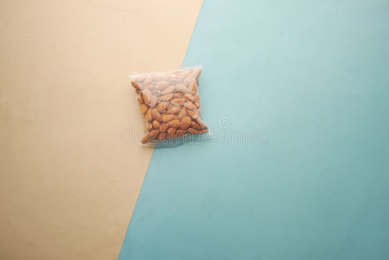 Peeled Peanuts in a Plastic Packet on Color Table Stock Image - Image ...