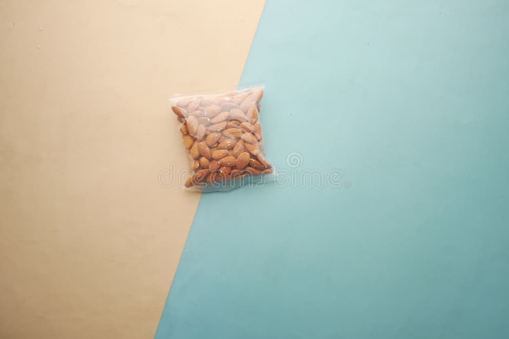 Peeled Peanuts in a Plastic Packet on Color Table Stock Image - Image ...