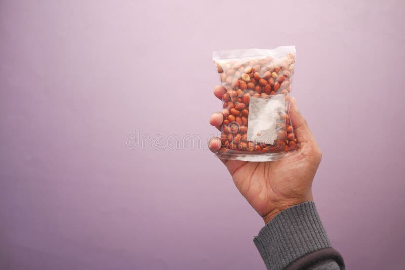 Peeled Peanuts in a Plastic Packet on Hand Stock Image - Image of ...