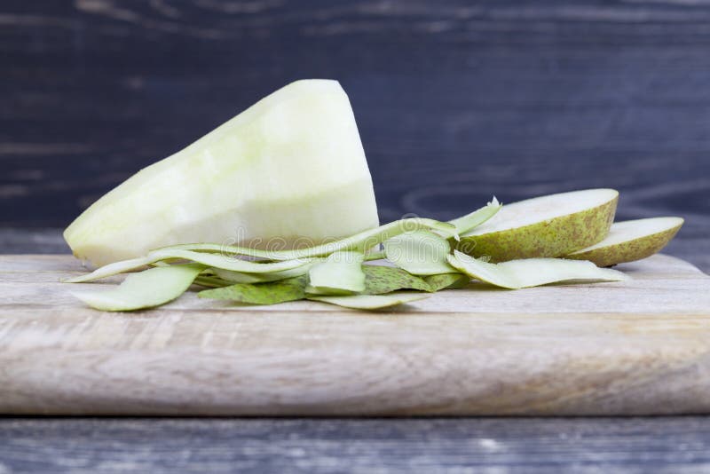 Peeled Pear With A Tool For Peeling On Wooden Board Stock Photo - Image ...