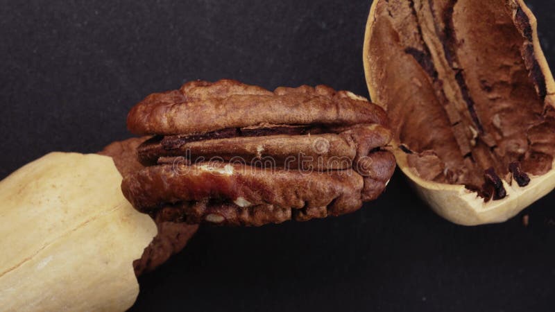 The Peeled Pecans are Spinning. Nut Shell. Close-up. Black Background ...