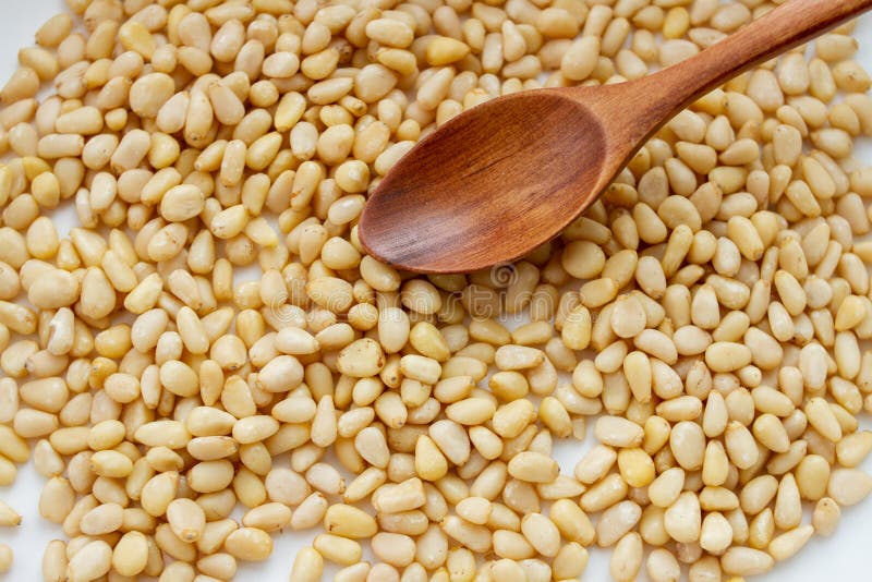Peeled Pine Nut in a Wooden Spoon. Background of Pine Nuts Stock Image ...