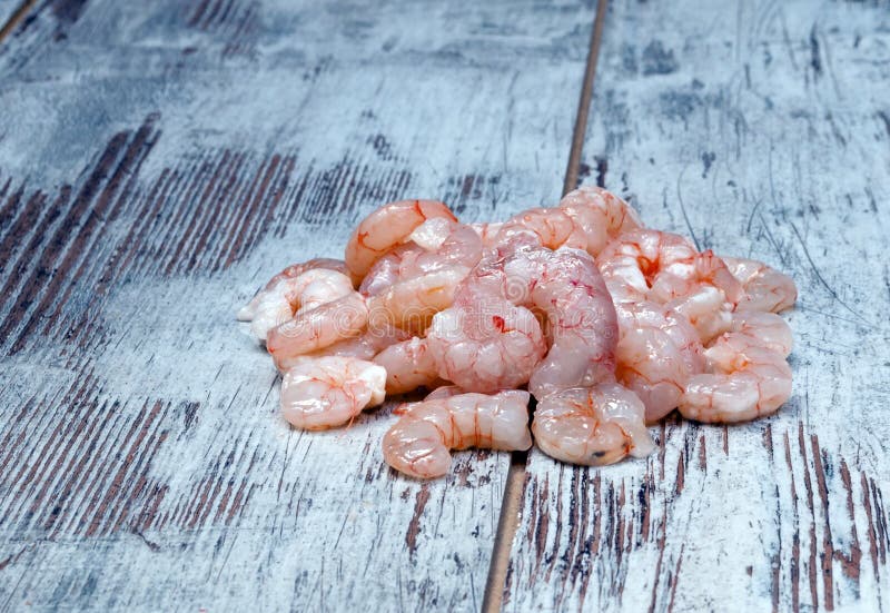 Peeled prawn in chopsticks stock photo. Image of cooked - 115135960