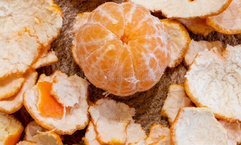 Peeled Ripe Tangerine in the Middle of Peel on Dining Table Stock Image ...