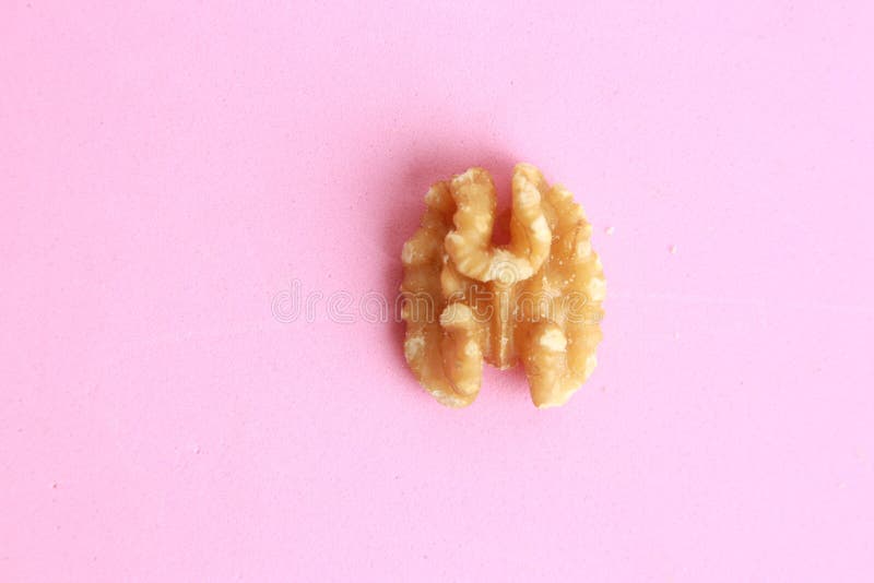 Peeled Walnut on a Pink Surface Stock Photo - Image of tasty, natural ...