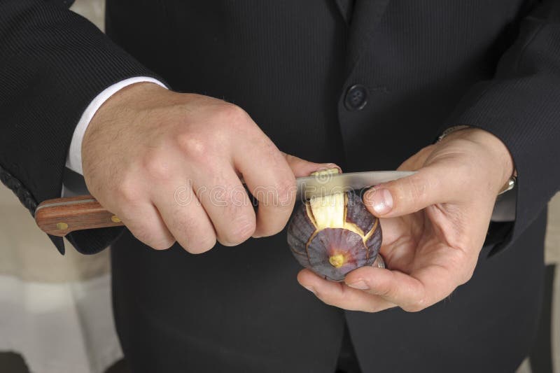 Peeling a fig stock photo. Image of catering, preparation - 23707430