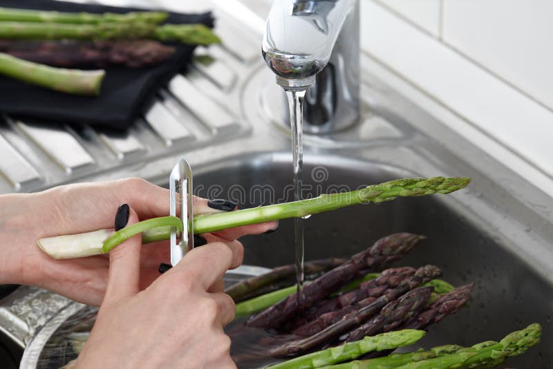 Peeling Fresh Asparagus in the Kitchen Stock Photo - Image of organic ...