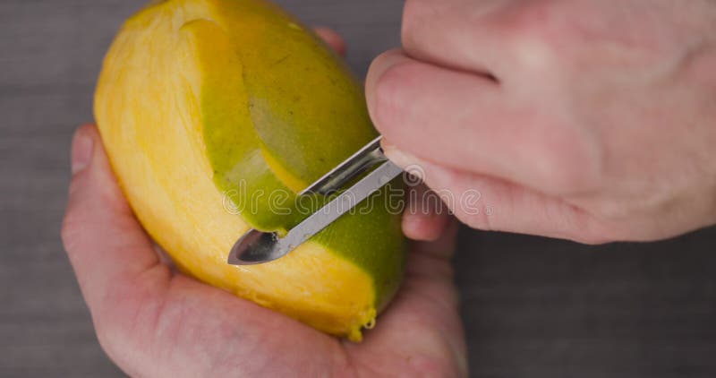 Peeling the Mango from the Peel. Stock Footage - Video of carrot, peels ...