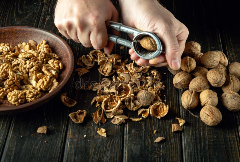 Peeling Nuts from a Hard Shell by the Hands of a Cook Using a ...